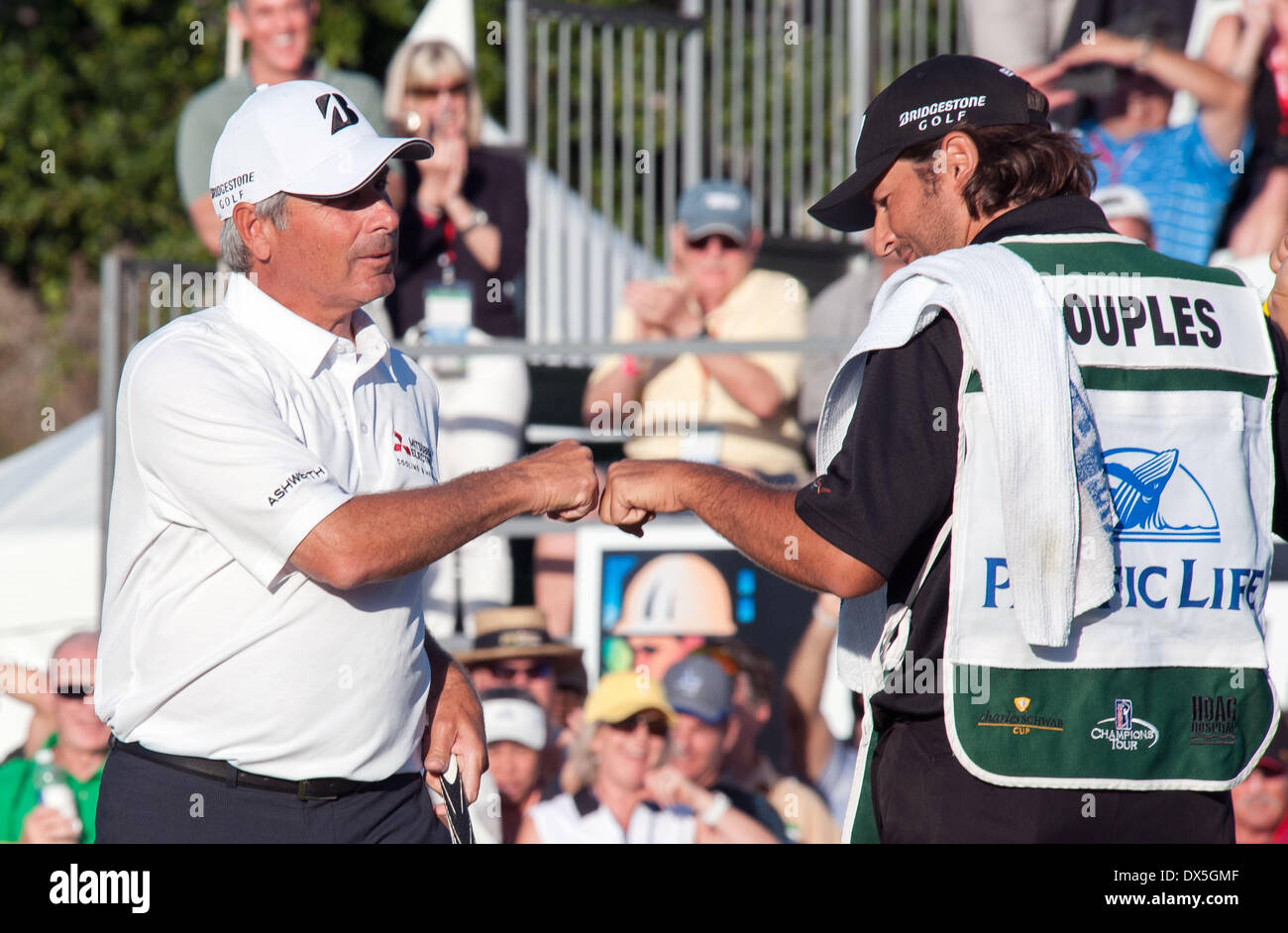 March 16, 2014 - Fred Couples gives his caddy Angel a fist bump as he ...