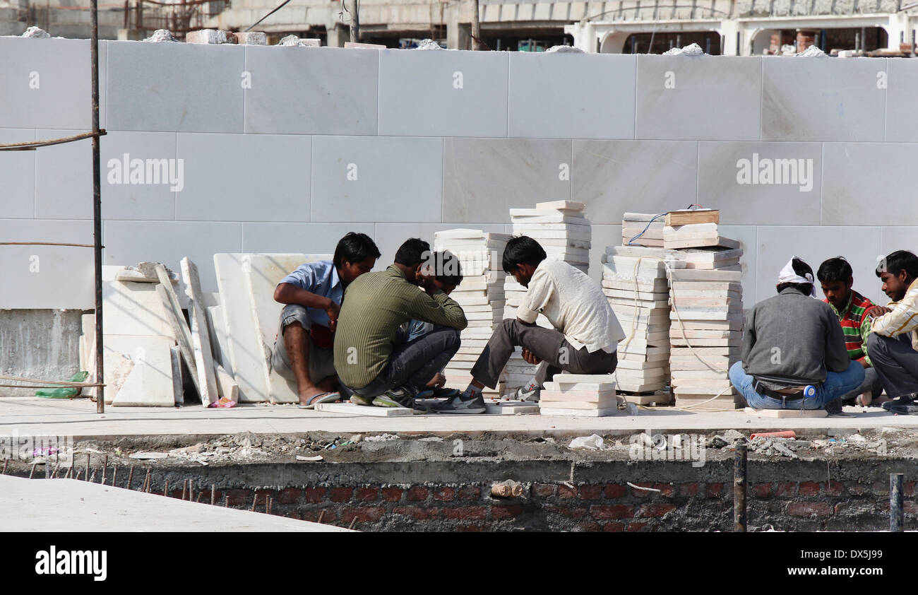 Working to make marble tiles at construction site inside the Golden ...