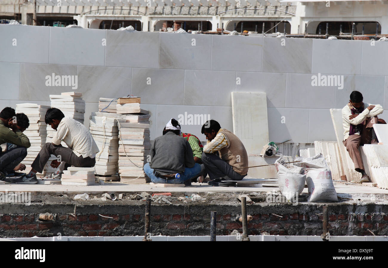 Working to make marble tiles at construction site inside the Golden ...
