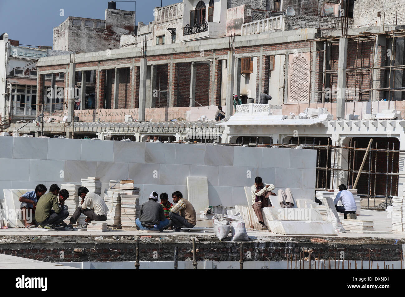 Workers and marble slabs at construction site inside the Golden Temple ...