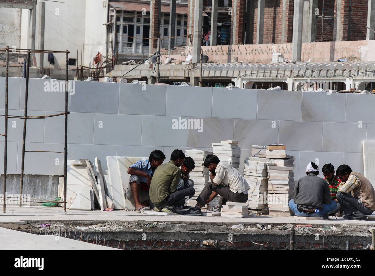 Workers and marble slabs at construction site inside the Golden Temple ...