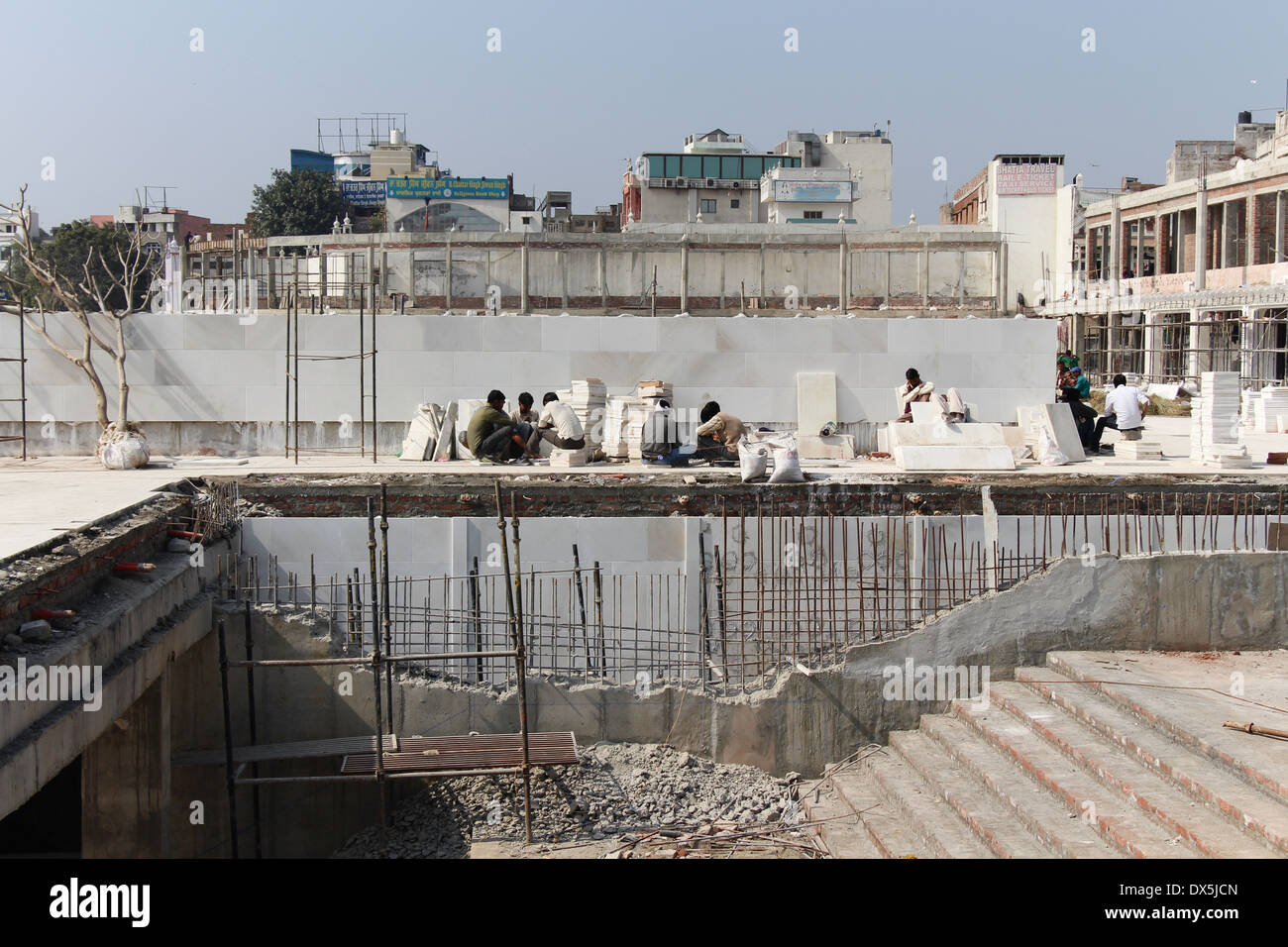 Multiple workers at construction site in the Golden Temple in Amritsar ...