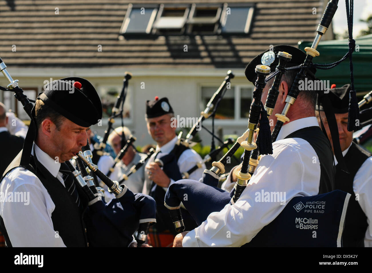 Pipe band competing at a Scottish Highland pipe band competition. The ...