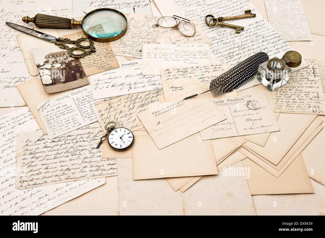 old letters and postcards, vintage accessory and photo of a family ...