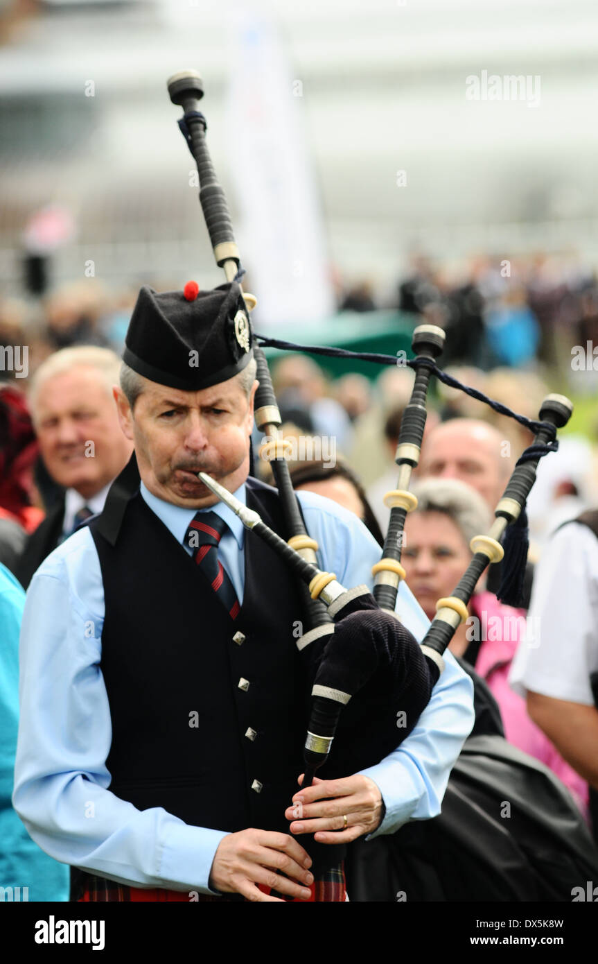 Pipe band competing at a Scottish Highland pipe band competition. The ...