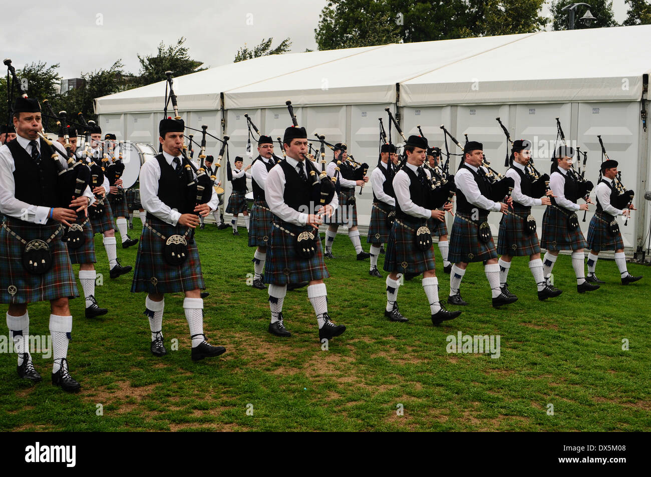 Pipe band competing at a Scottish Highland pipe band competition. The ...