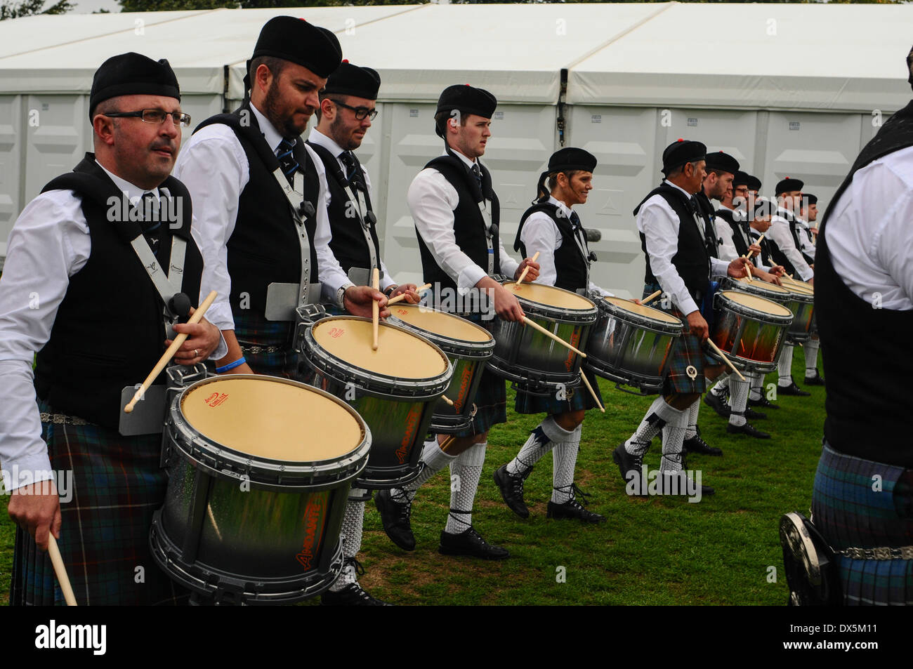 Pipe band competing at a Scottish Highland pipe band competition. The ...