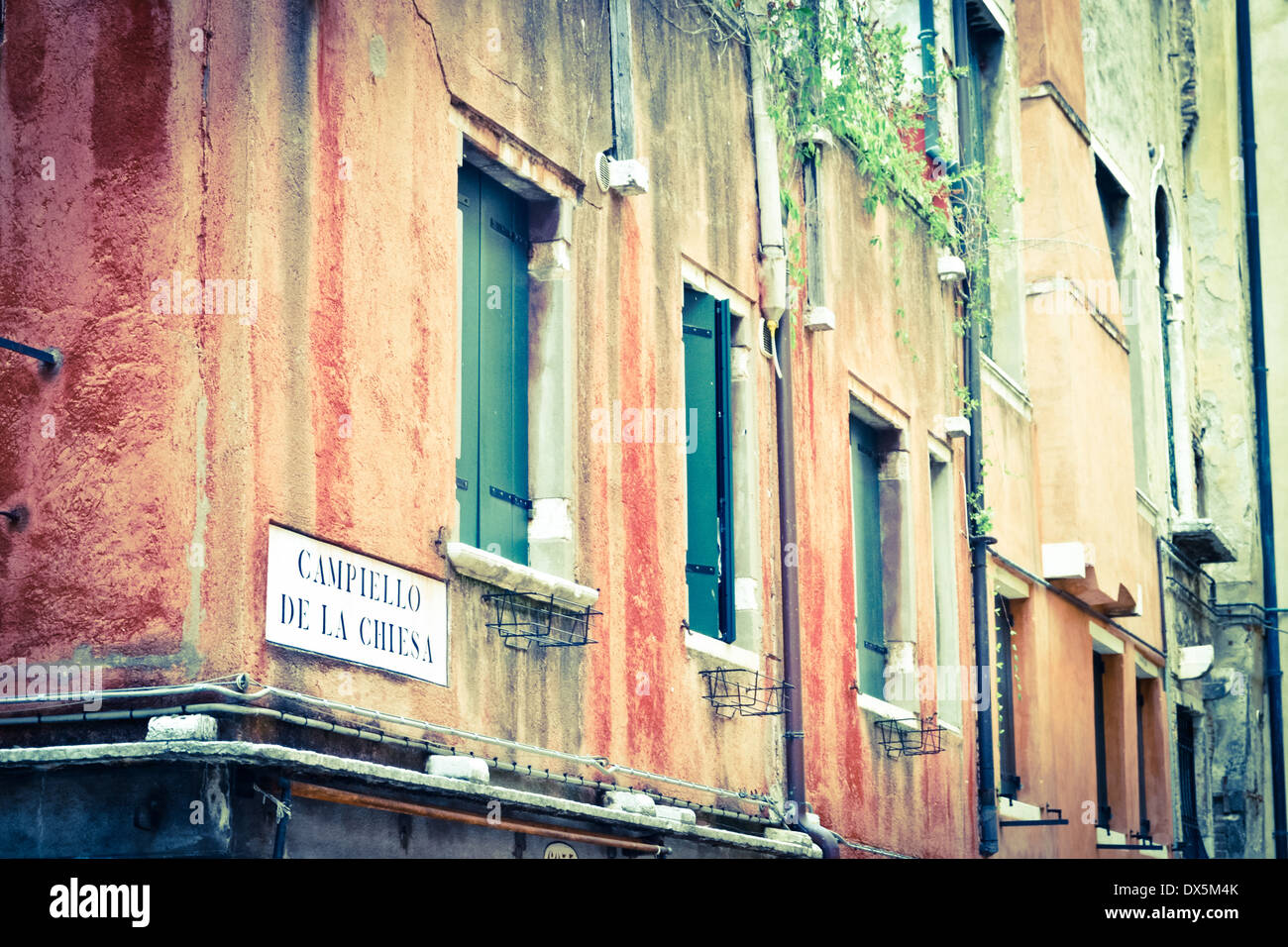 Windows line a Venice walkway Stock Photo - Alamy