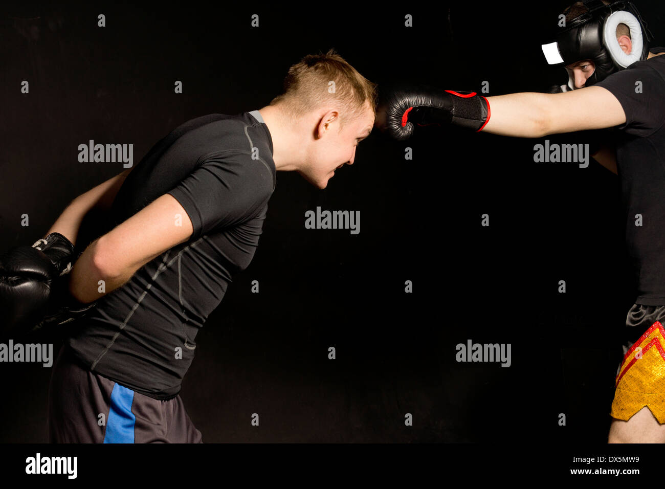 Two boxers spoofing in the ring during training as the one obliging ...