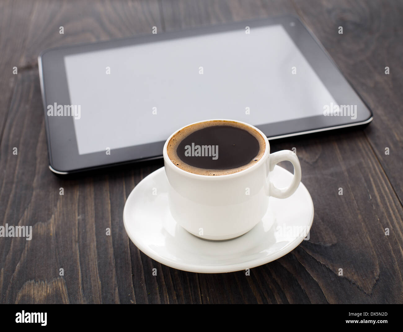 Cup of coffee and tablet Stock Photo - Alamy