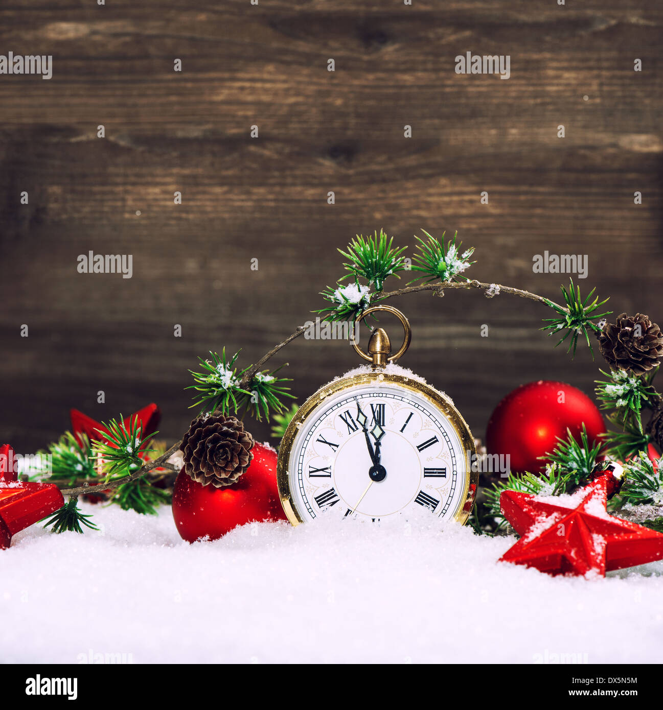 christmas decoration red stars, baubles and antique golden clock in ...