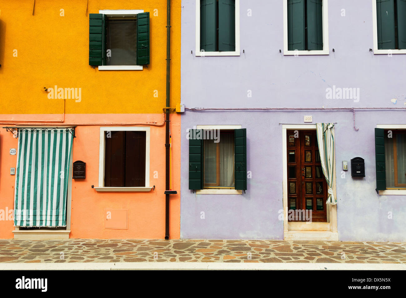 Burano an island known for brightly multi colored homes and boats on ...