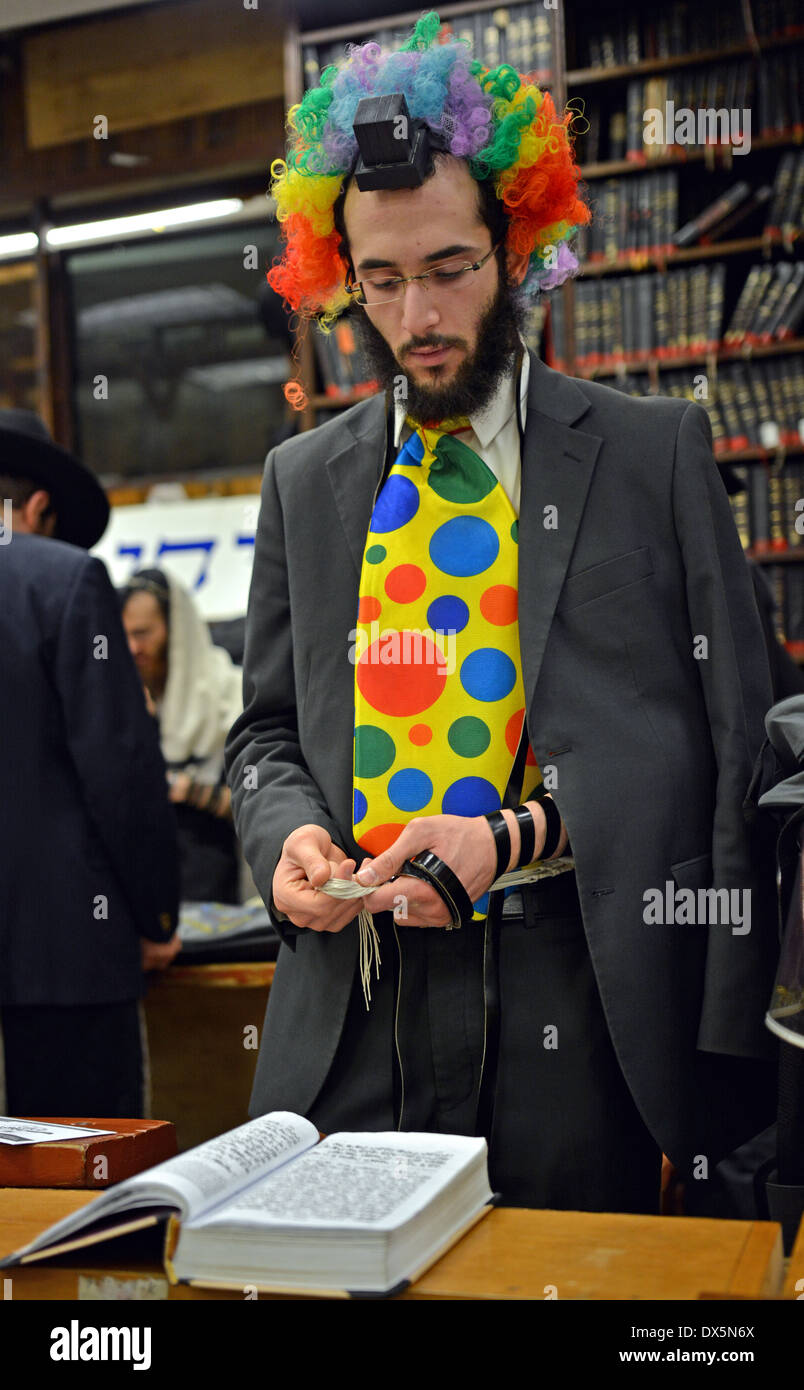 A religious Jewish young man wearing a funny costume at morning prayers ...