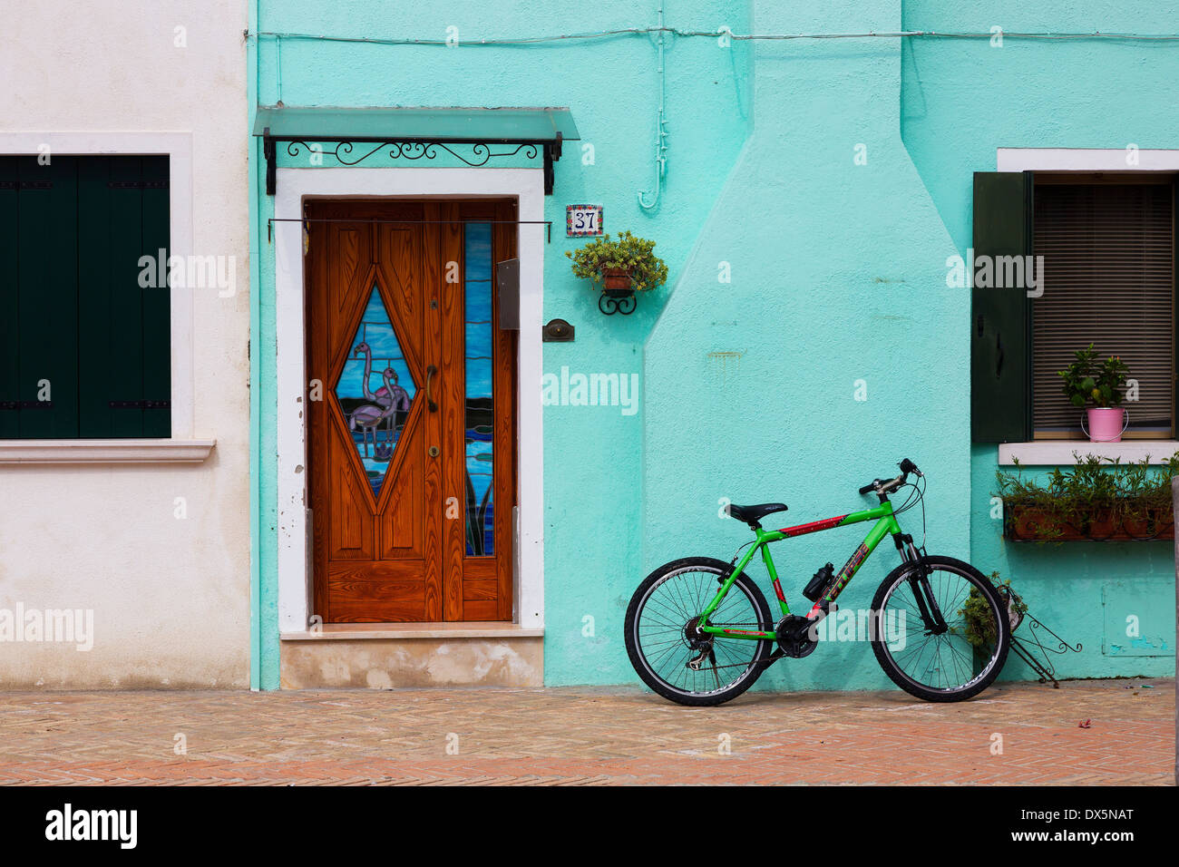 Burano an island known for brightly multi colored homes and boats on ...