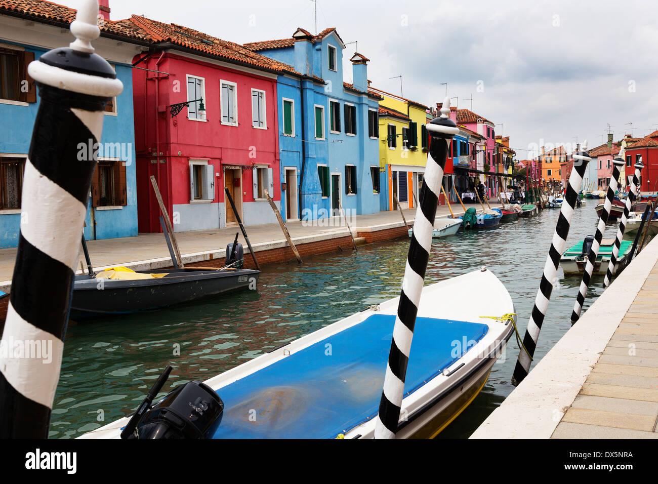 Burano an island known for brightly multi colored homes and boats on ...