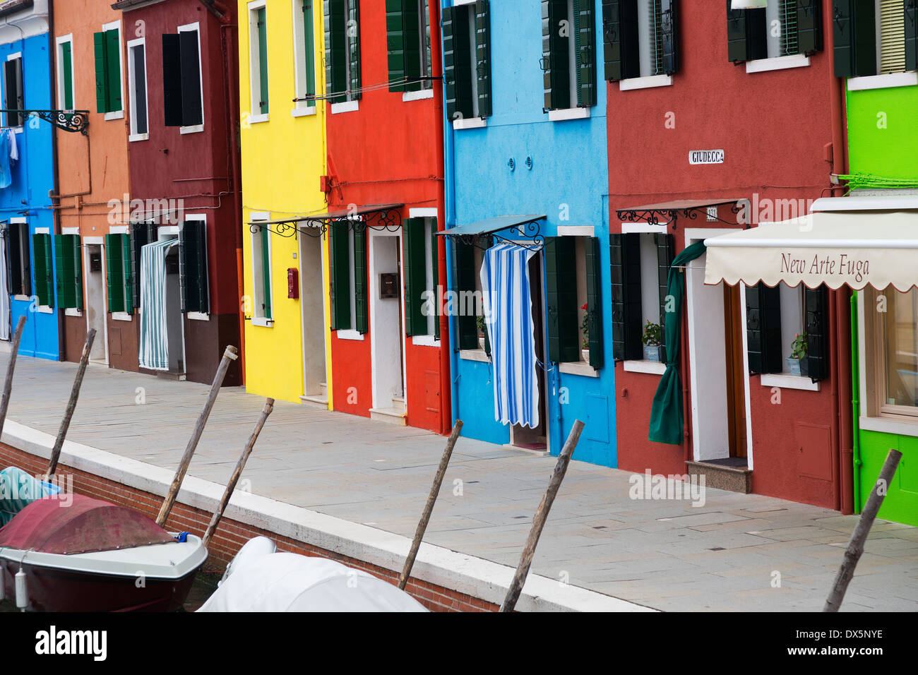 Burano an island known for brightly multi colored homes and boats on ...