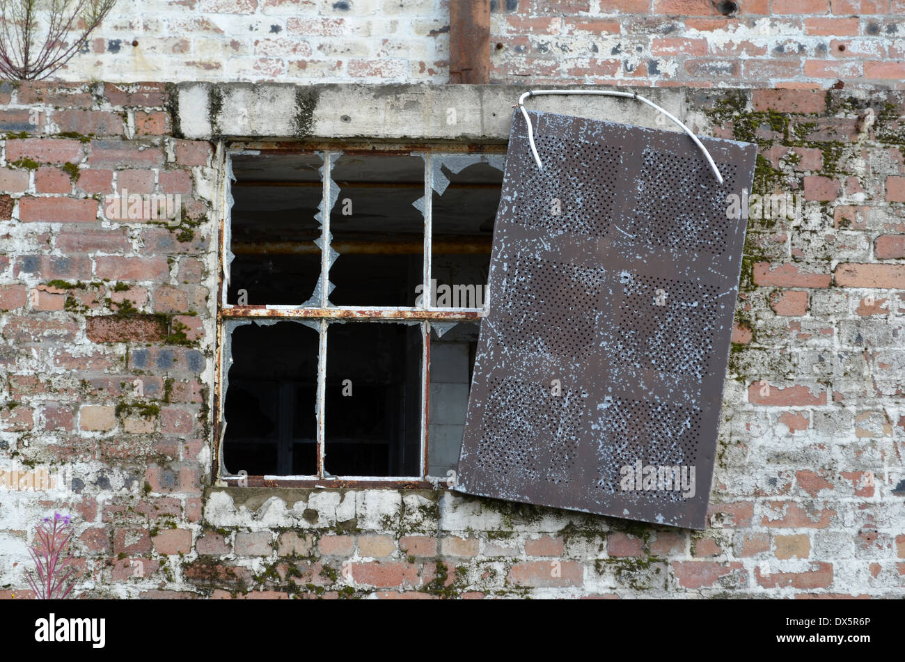 Derelict factory toilet window Stock Photo - Alamy