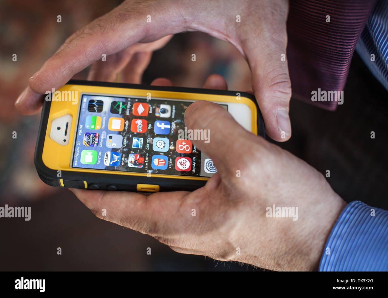 Checking his smart phone hi-res stock photography and images - Alamy