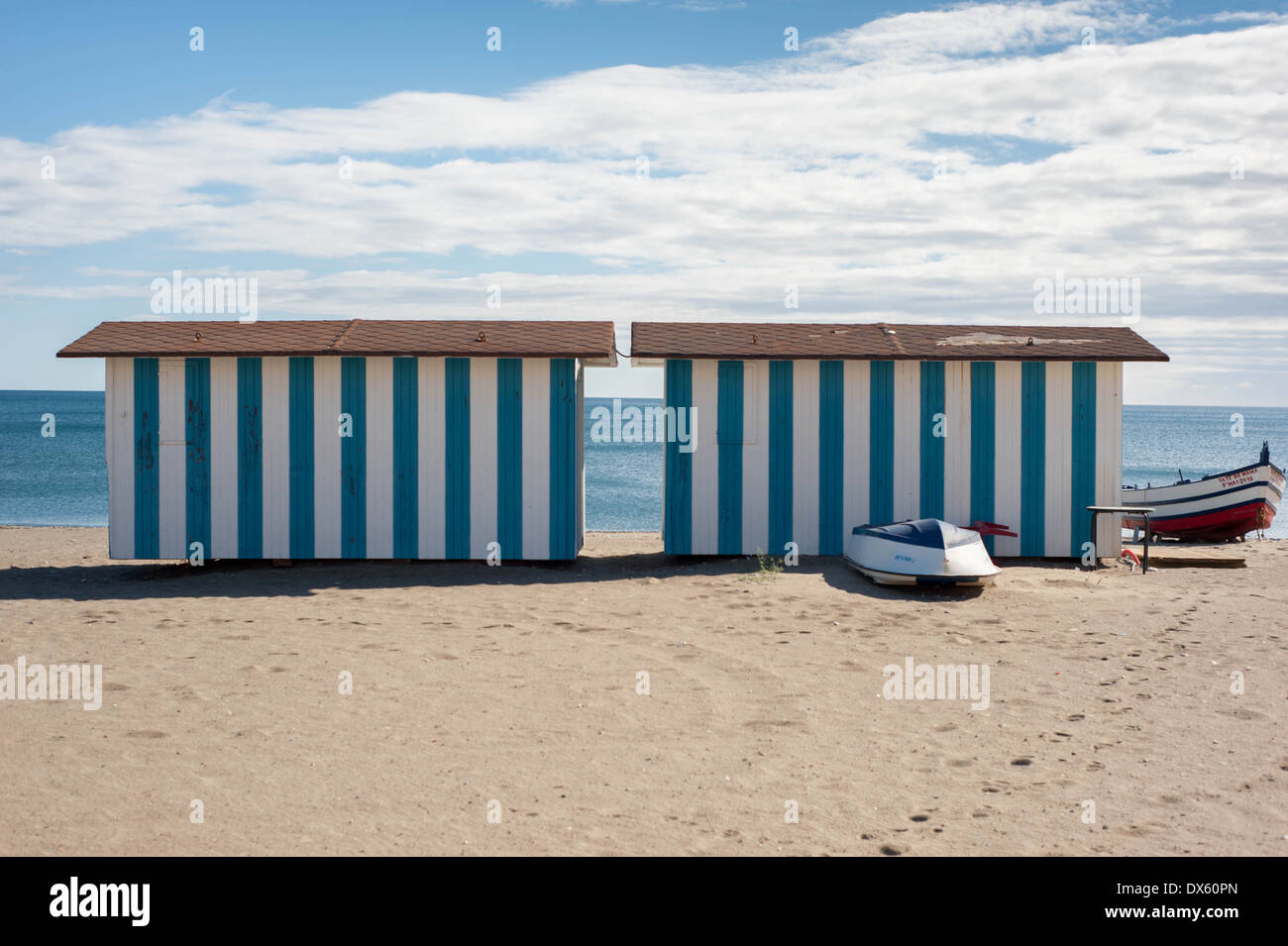 Striped beach huts on the beach at Estepona on Spain's Mediterranean ...