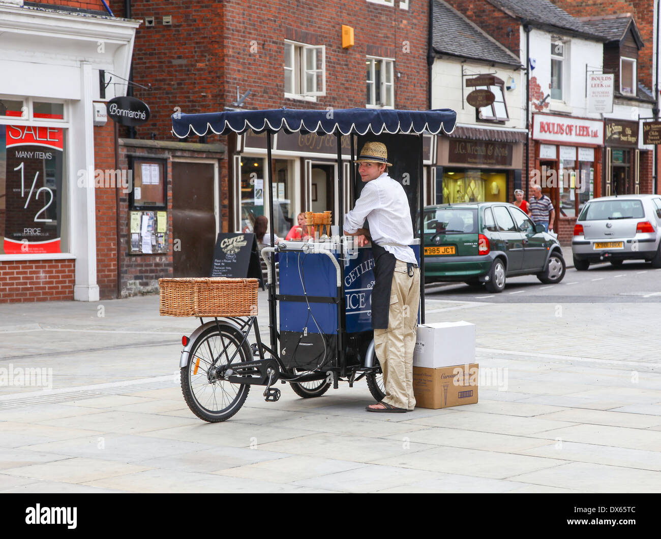 A mobile ice cream seller or vendor with his tricycle cycle in the ...