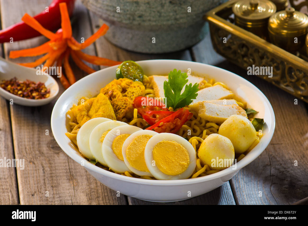 Hot and spicy Singapore Curry Noodle with decoration setup Stock Photo ...
