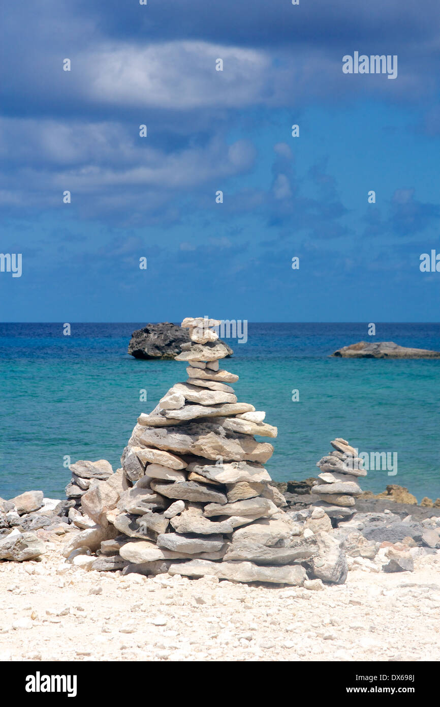 Tower of stacked rocks on a Caribbean beach in the Bahamas Stock Photo ...