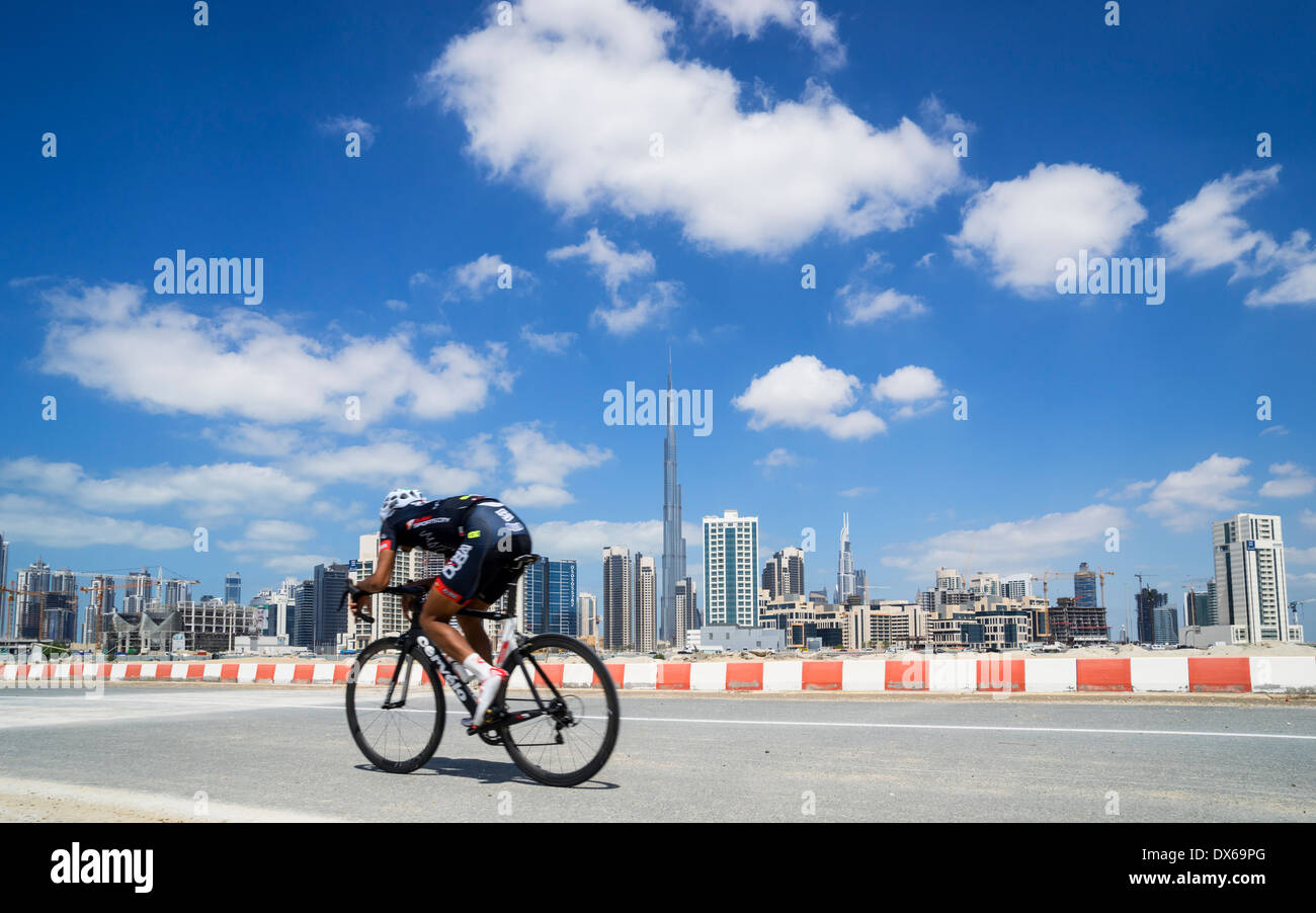 Cyclists on cycle track with skyline of Dubai in United Arab Emirates ...