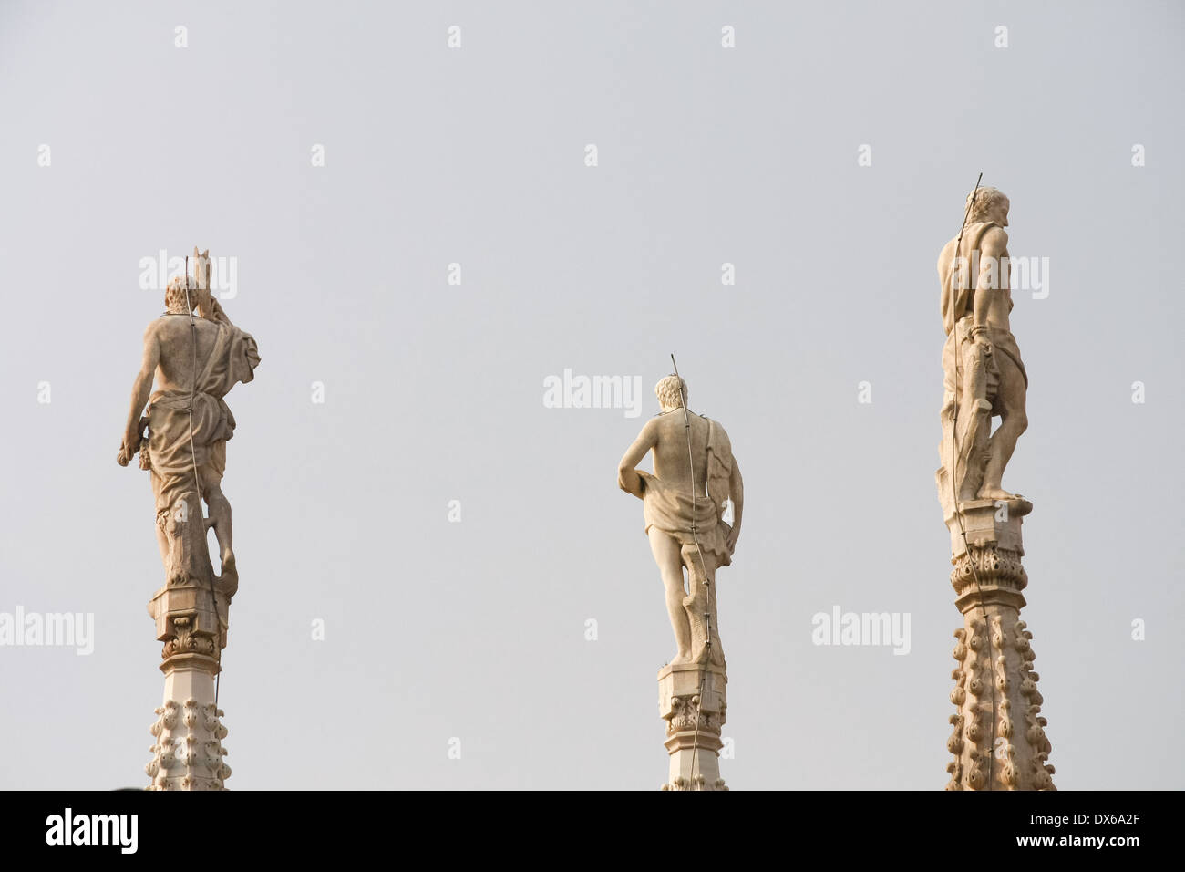 Close-up view of some spires and statues of the Duomo Cathedral Stock ...