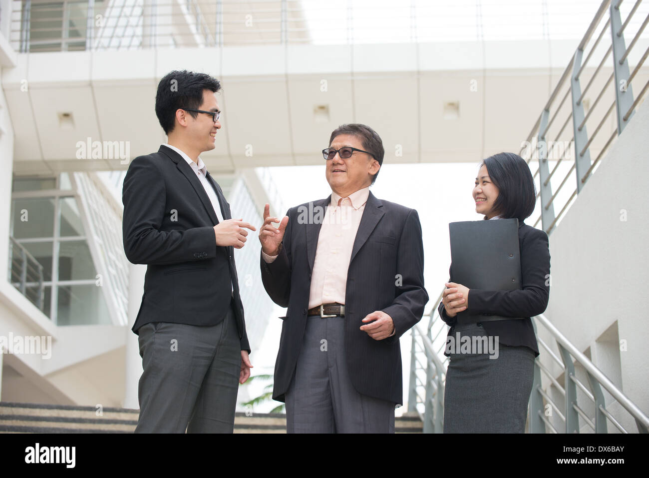 asian business team in conversation with office background Stock Photo ...