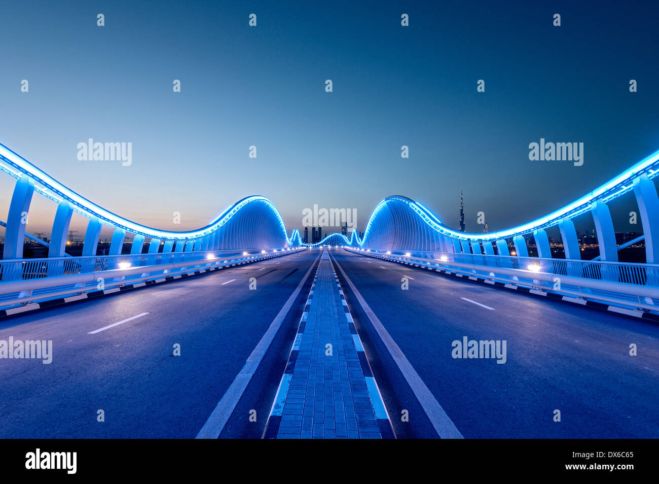 Modern architectural illuminated bridge at Meydan racecourse in Dubai ...