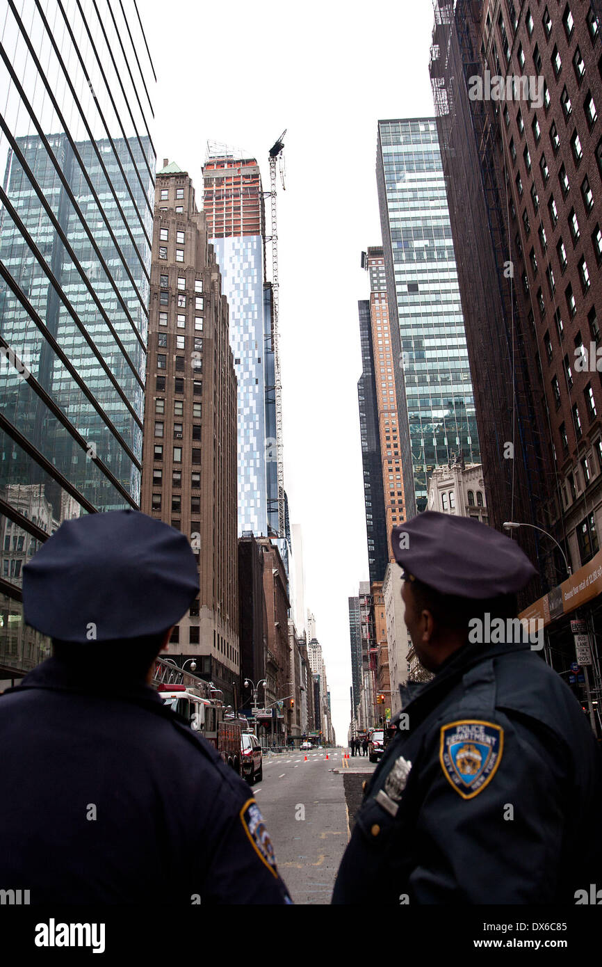 A crane boom that was damaged by Hurricane Sandy is still dangling from ...