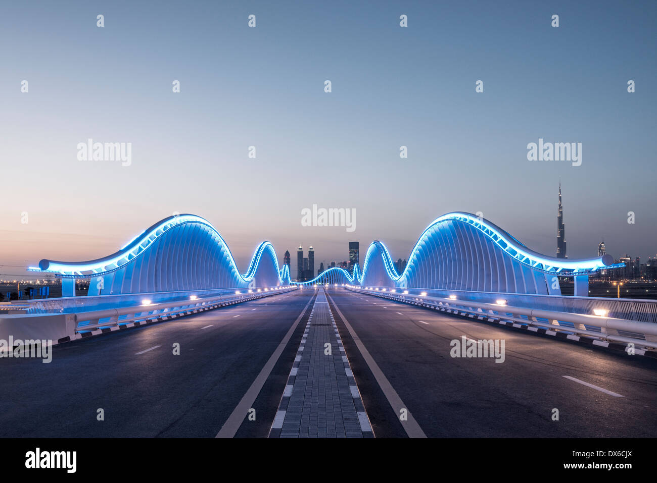 Modern architectural illuminated bridge at Meydan racecourse in Dubai ...