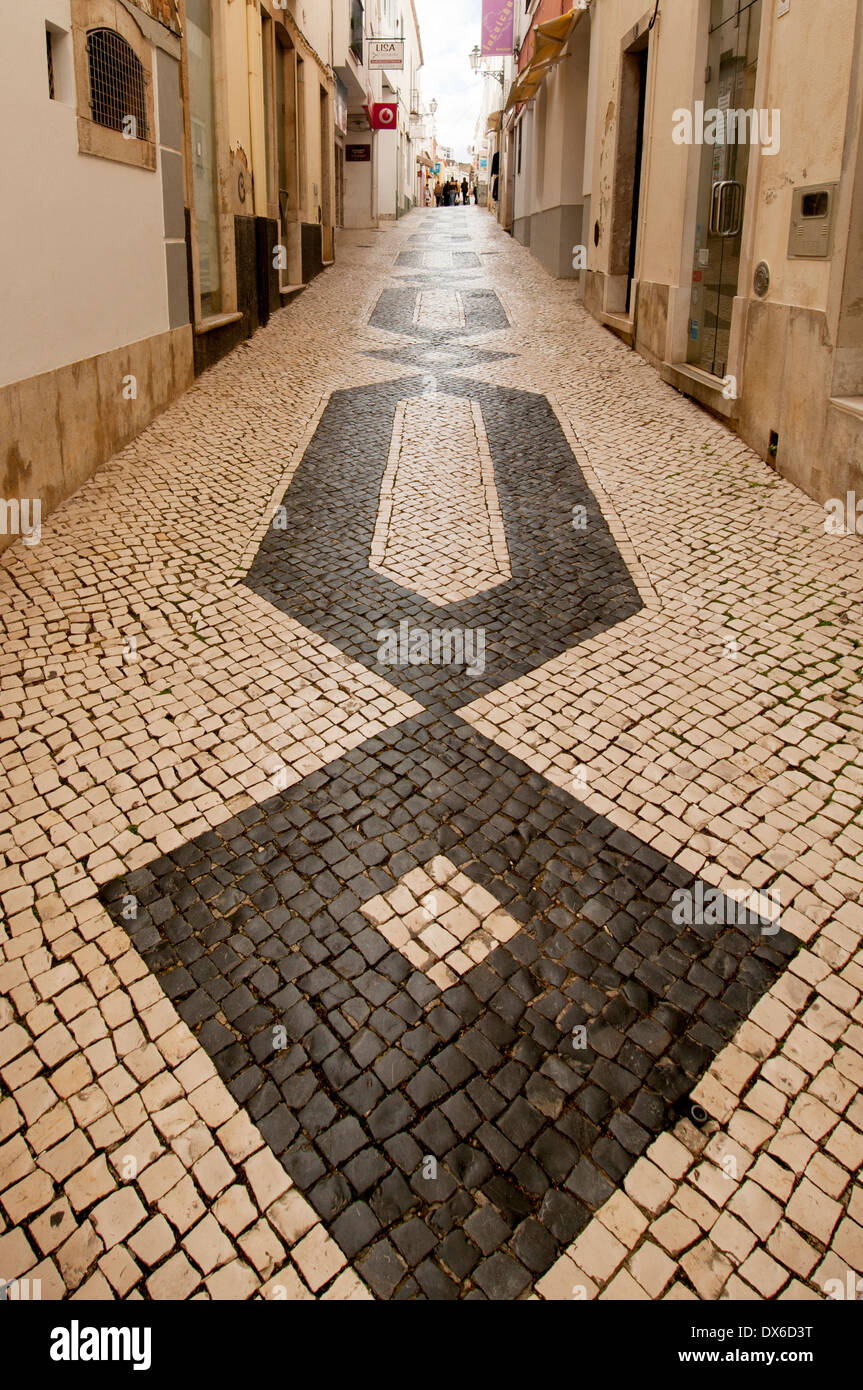 Traditional mosaic tiled street in the old town of Lagos, Portugal ...