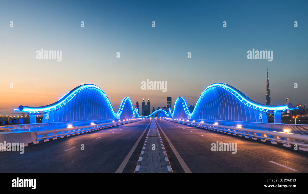 Modern architectural illuminated bridge at Meydan racecourse in Dubai ...