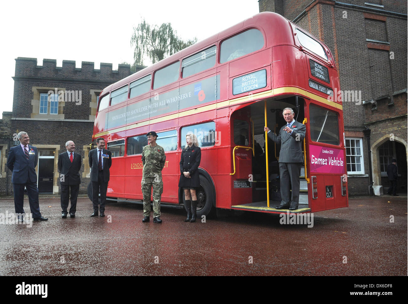 Prince Charles, Prince of Wales poses on a routemaster bus as he meets ...