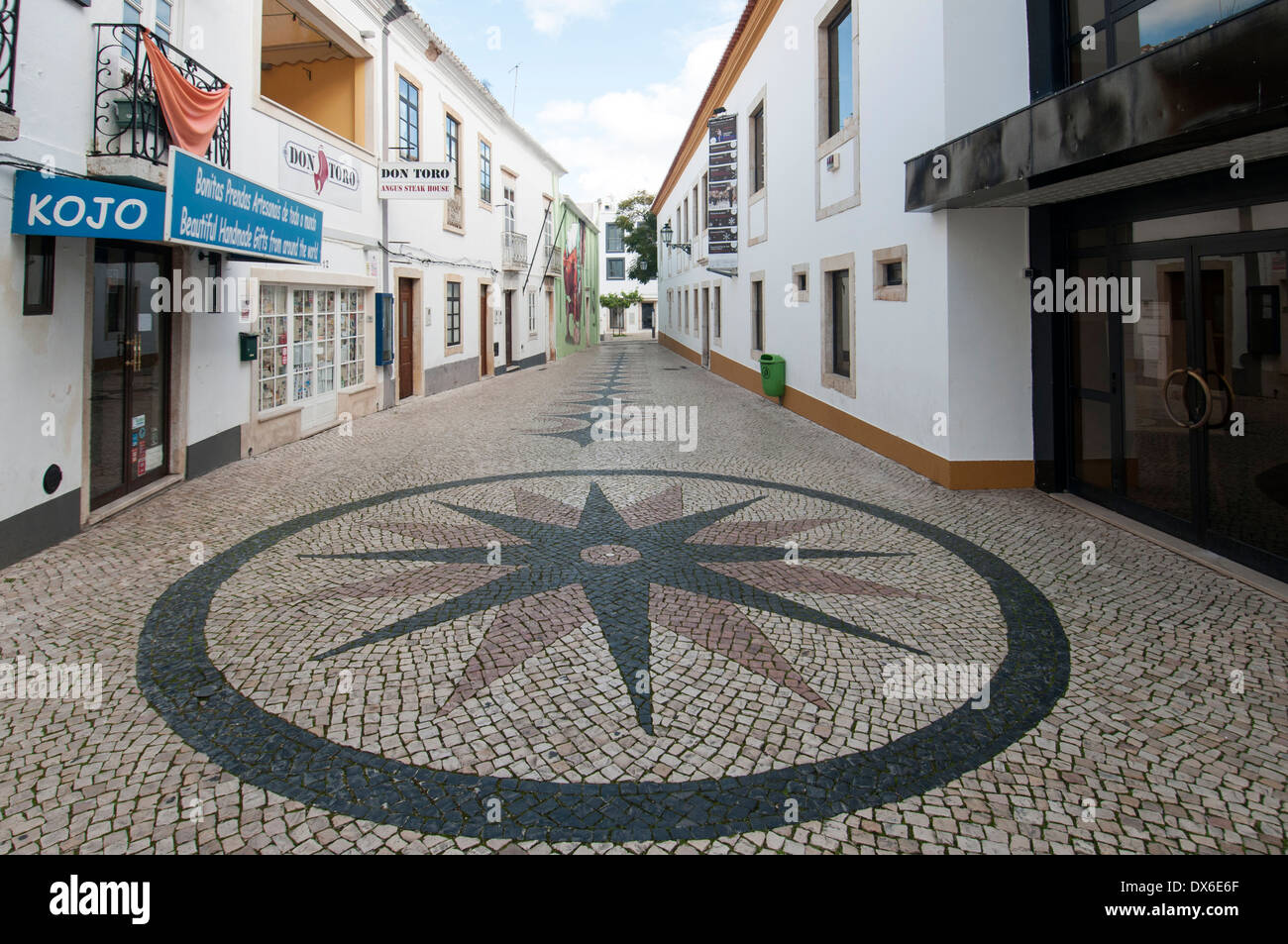 Traditional mosaic tiled street in the old town of Lagos, Portugal ...