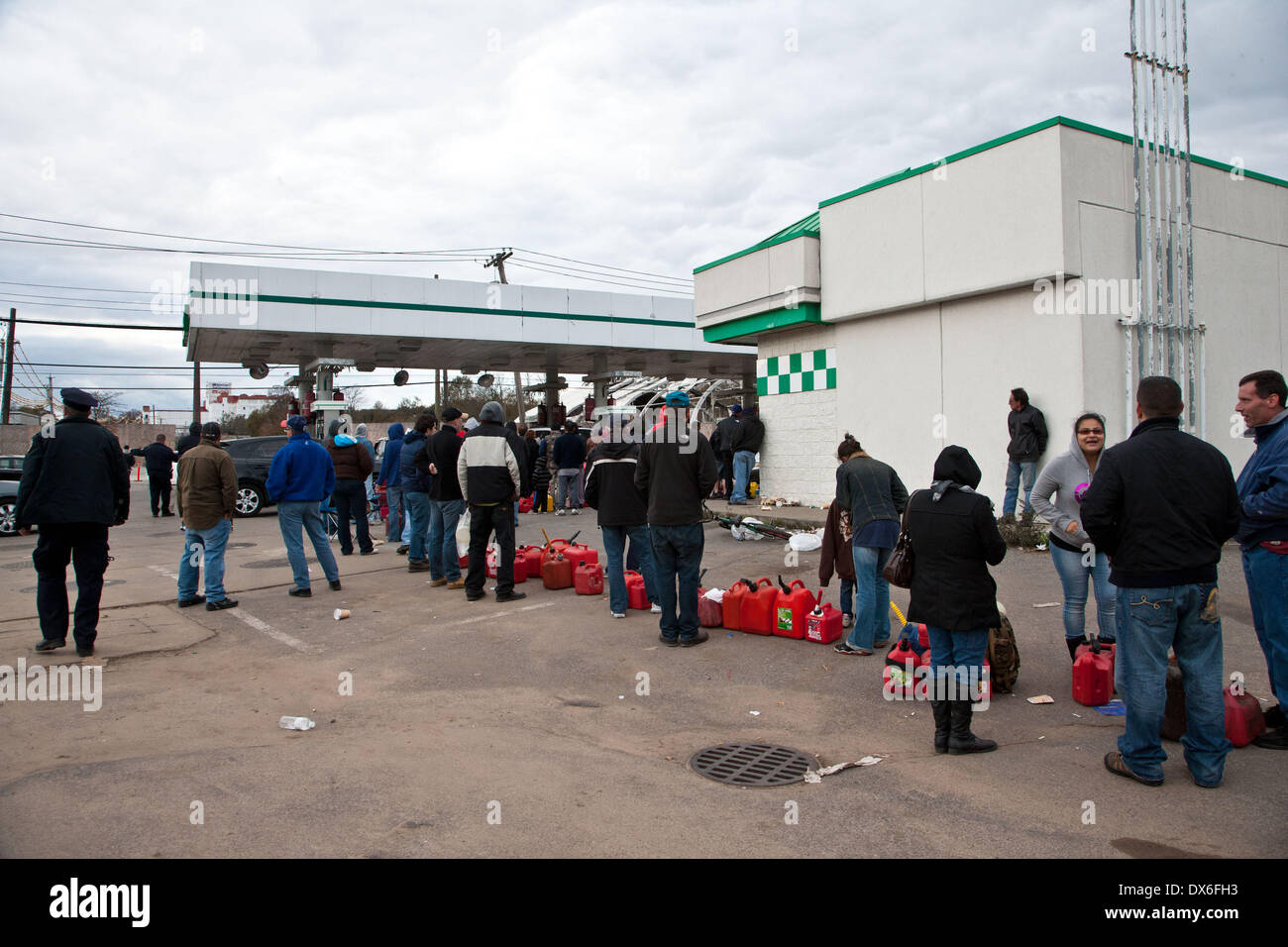 Atmosphere Police officers oversee the orderly distribution of fuel at ...