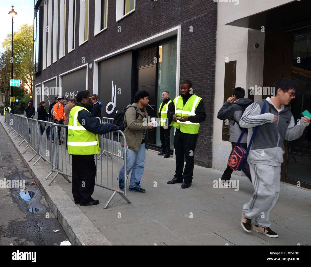 Atmosphere Customers queue outside the Apple store on London's Regent ...