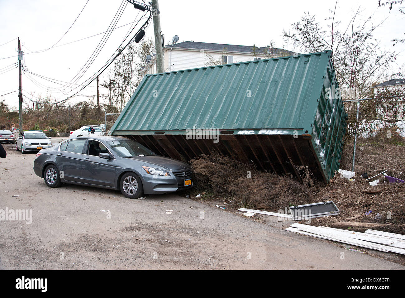 Atmosphere A car is crushed beneath a shipping container after being ...