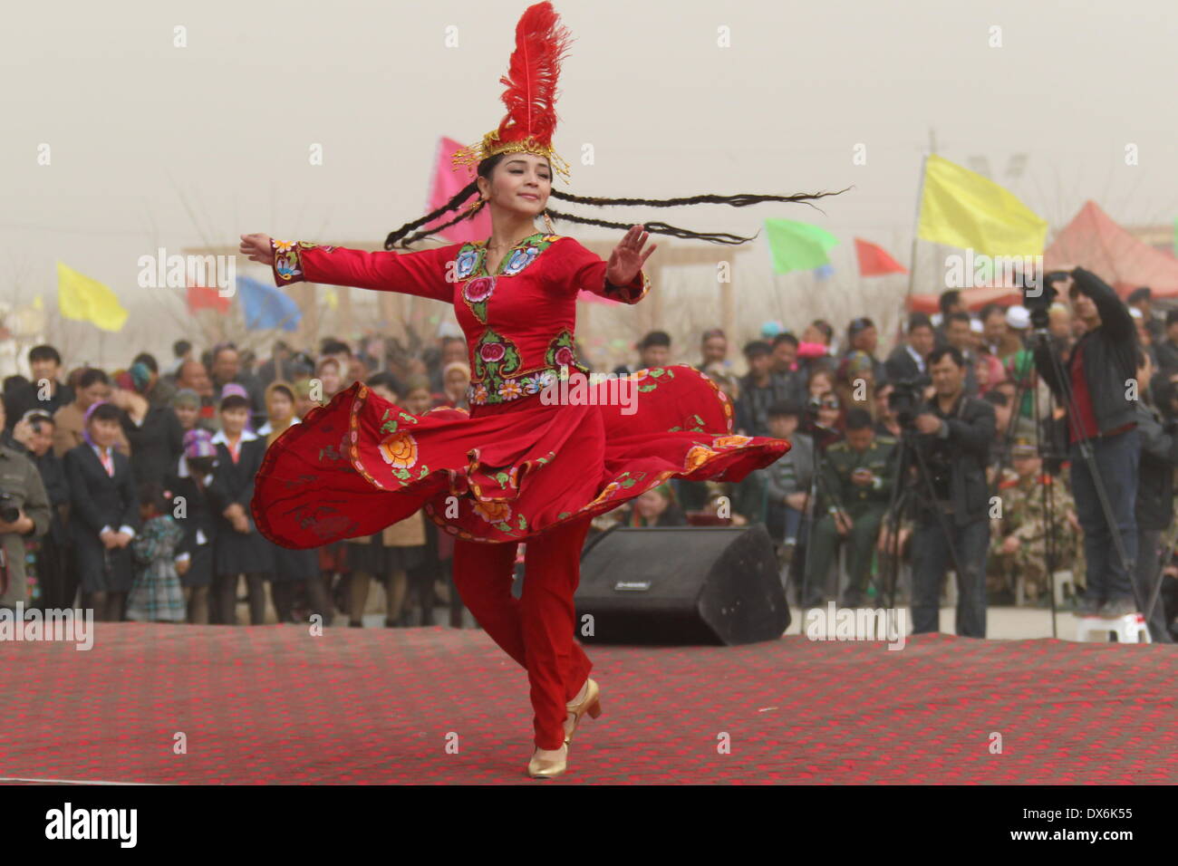 Hami, China's Xinjiang Uygur Autonomous Region. 19th Mar, 2014. A girl ...