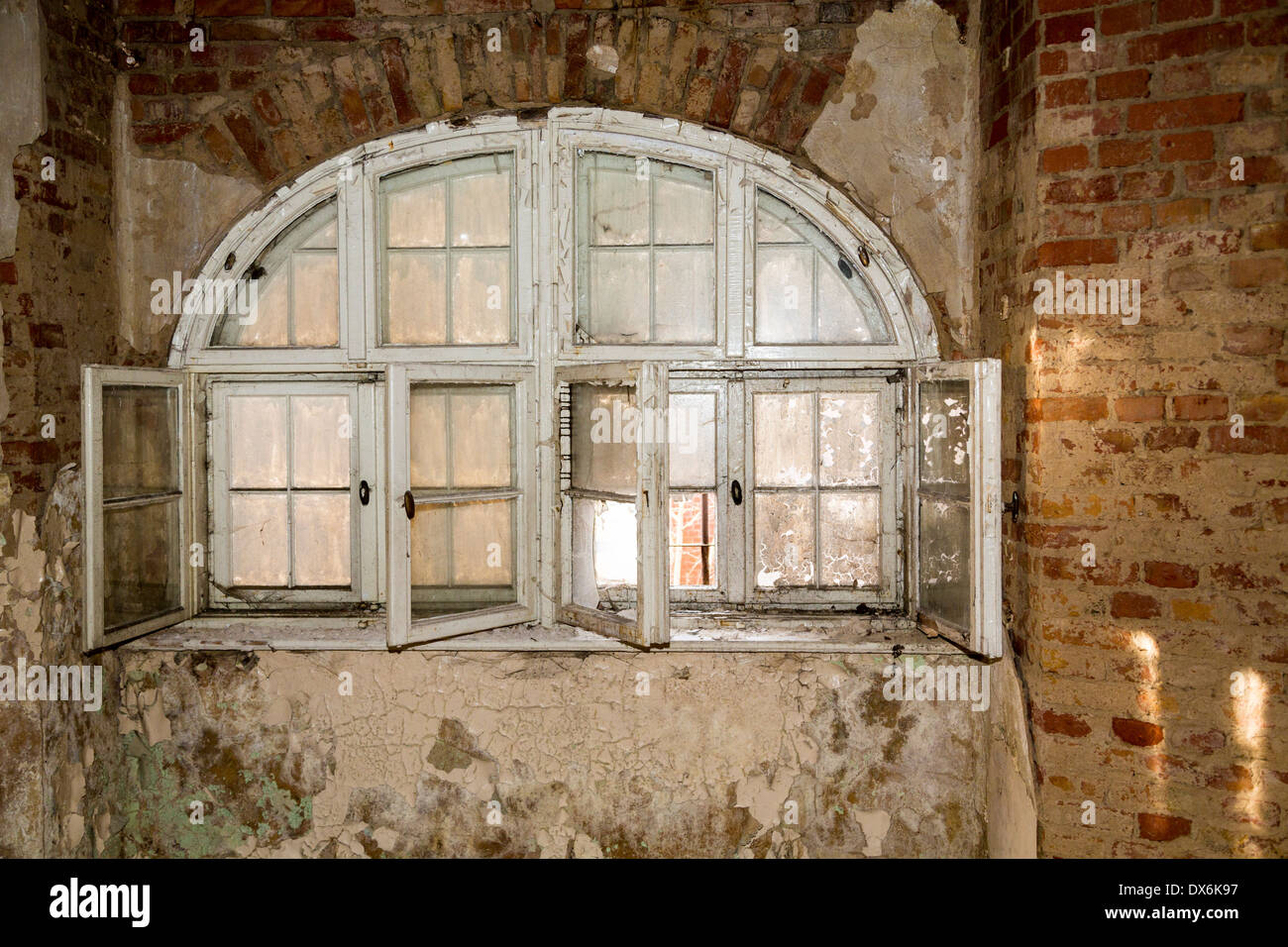 old round window on a brick wall with color on the glass Stock Photo ...