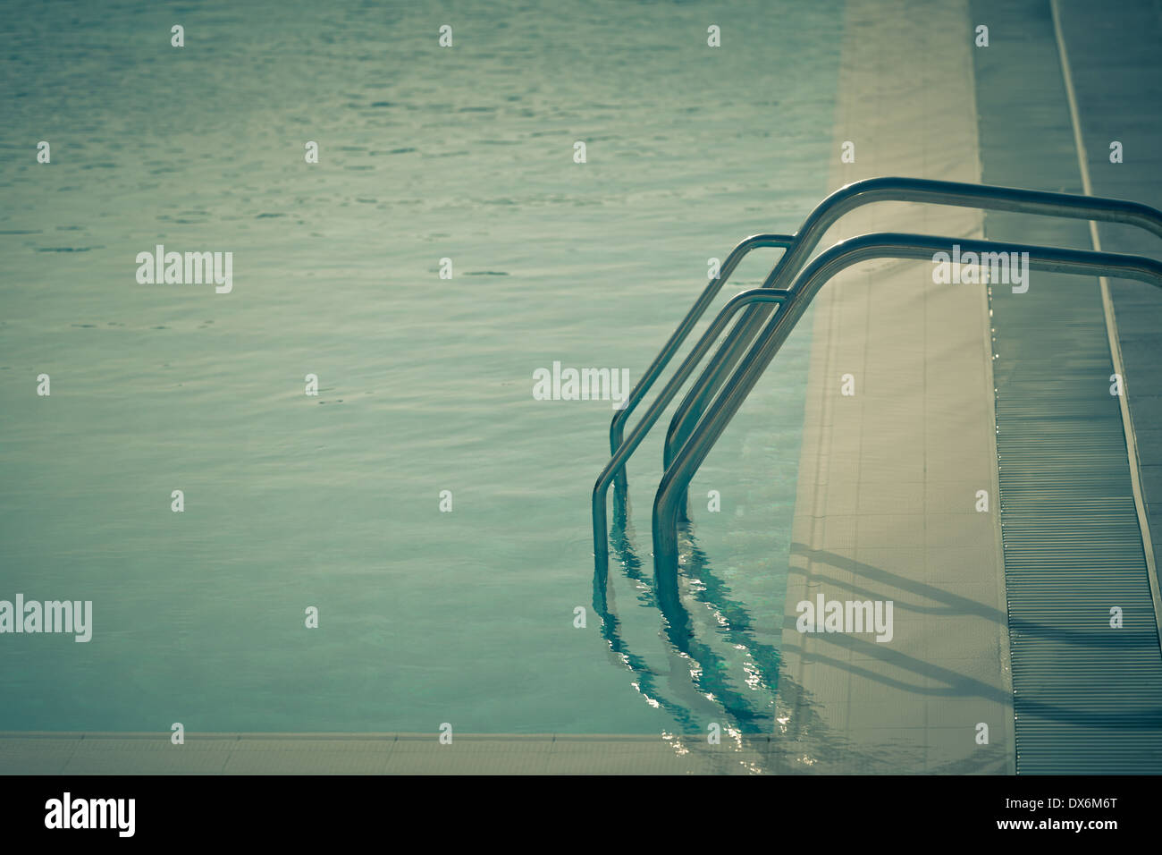 Ladder of a swimming pool. Horizontal vintage style shot Stock Photo ...