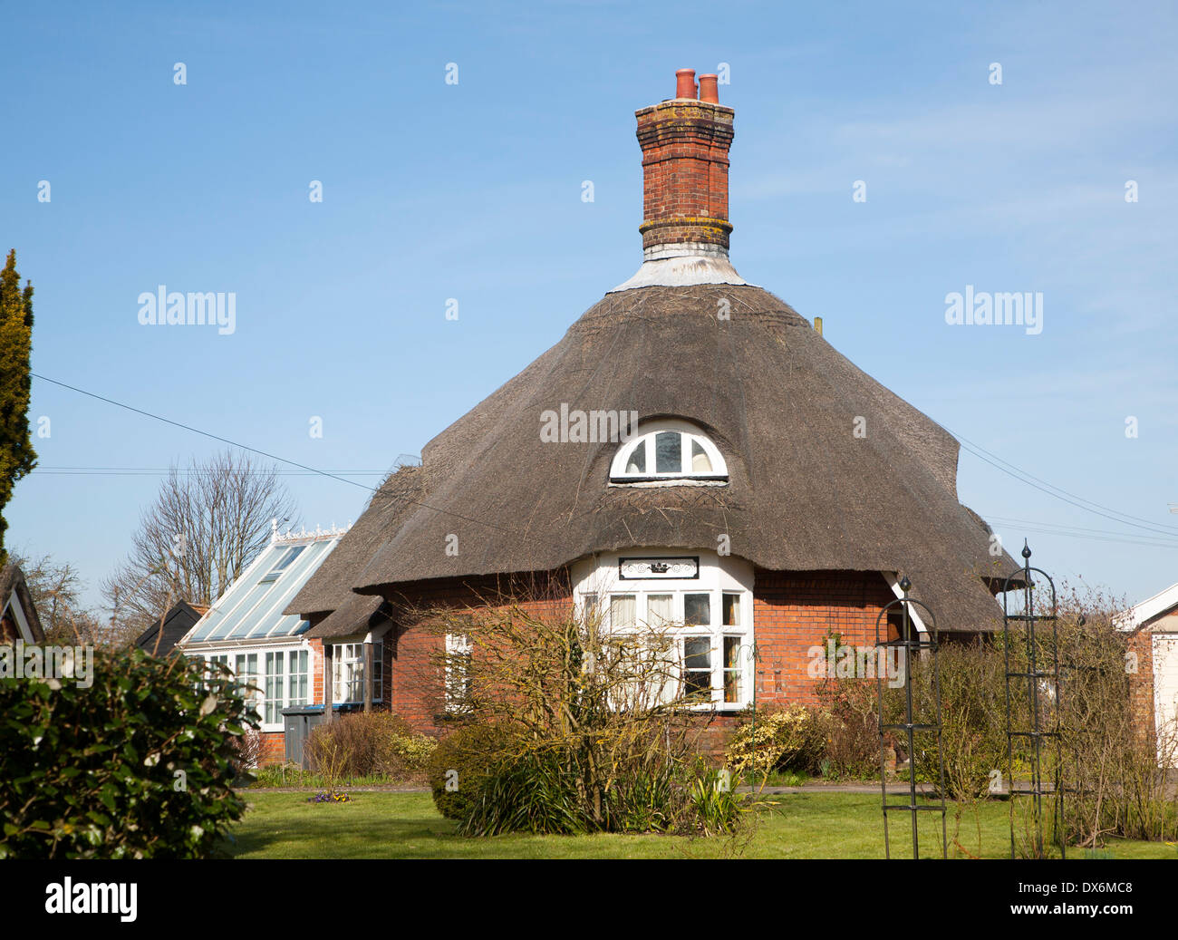 Unusual round thatched cottage at Easton village, Suffolk, England ...
