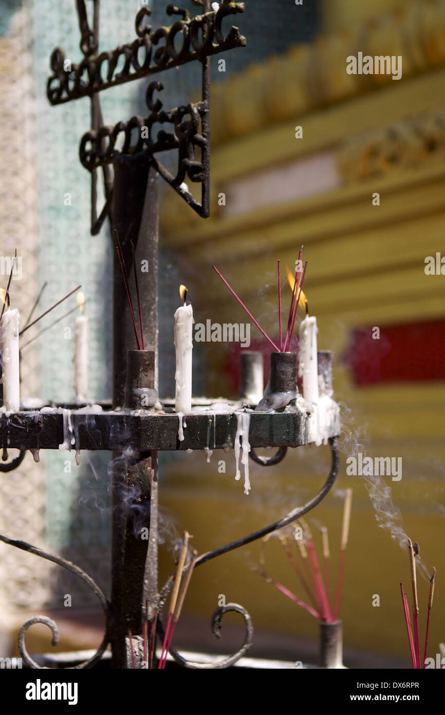 Candles and incense in the Sutaungpyei Pagoda at the peak of Mandalay ...