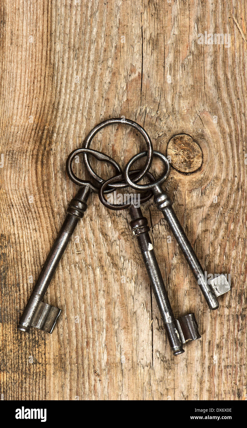 antique keys over dirty vintage wooden background Stock Photo - Alamy