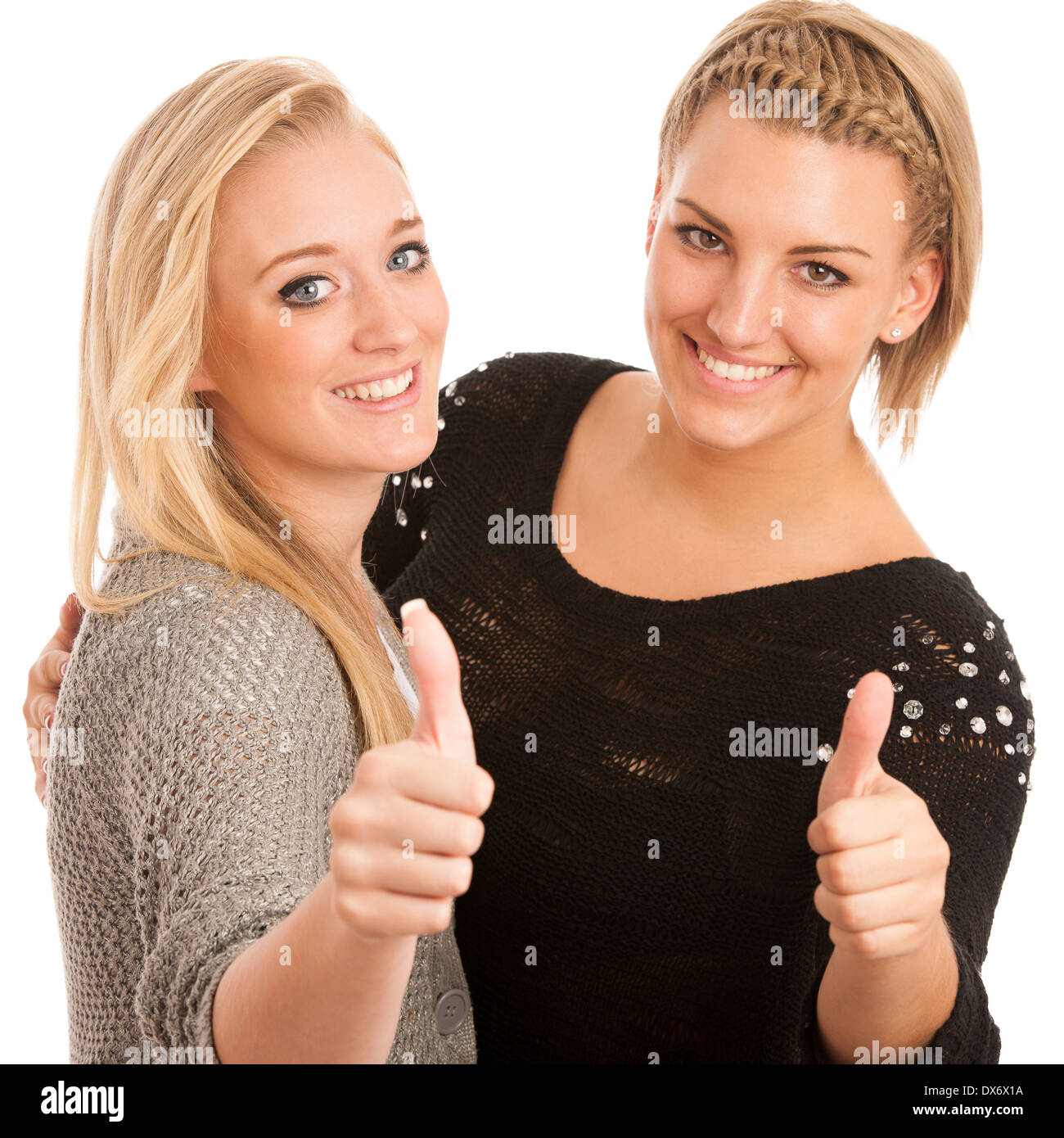 Two happy friends showing thumb up Stock Photo - Alamy