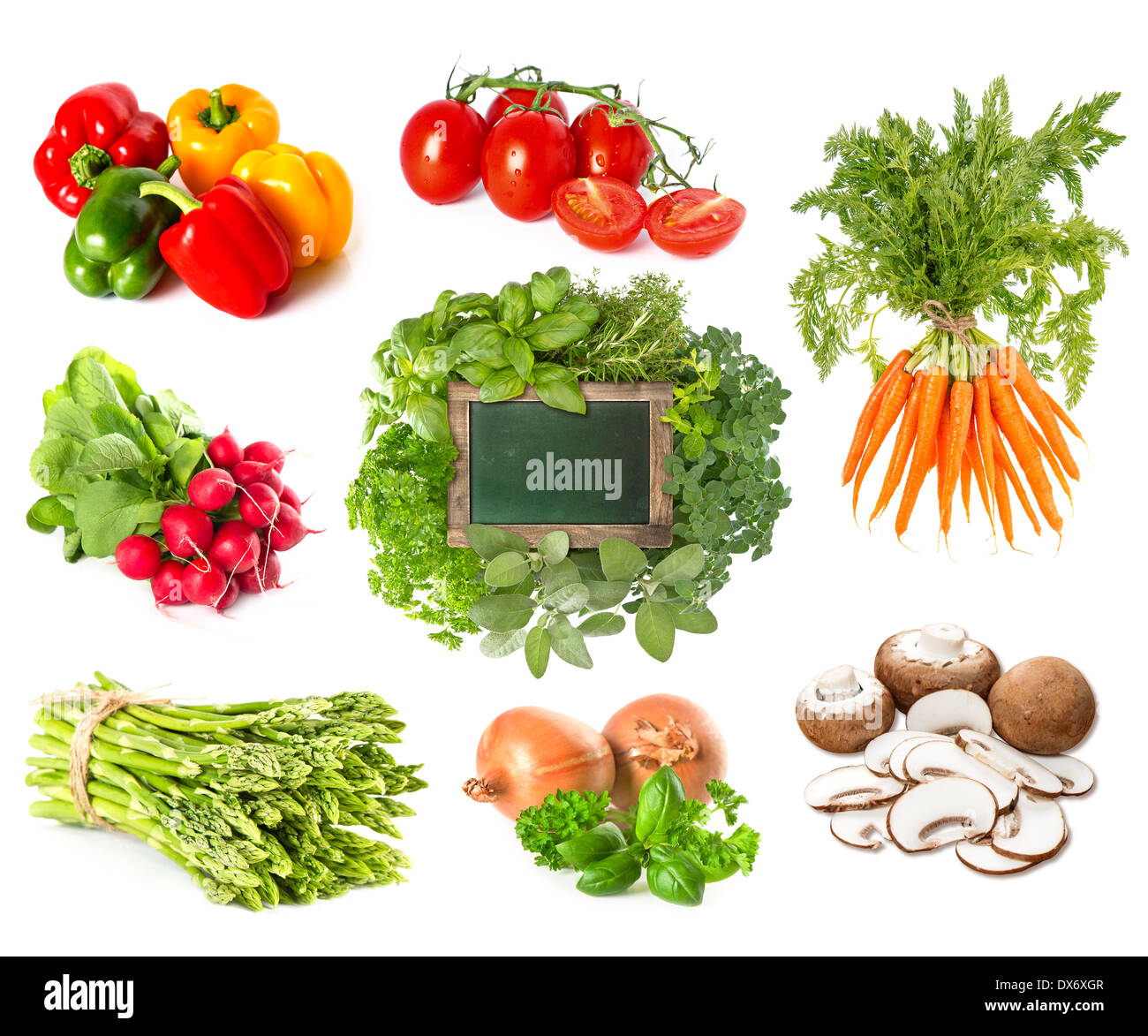 blank green blackboard with variety fresh herbs and vegetables isolated ...