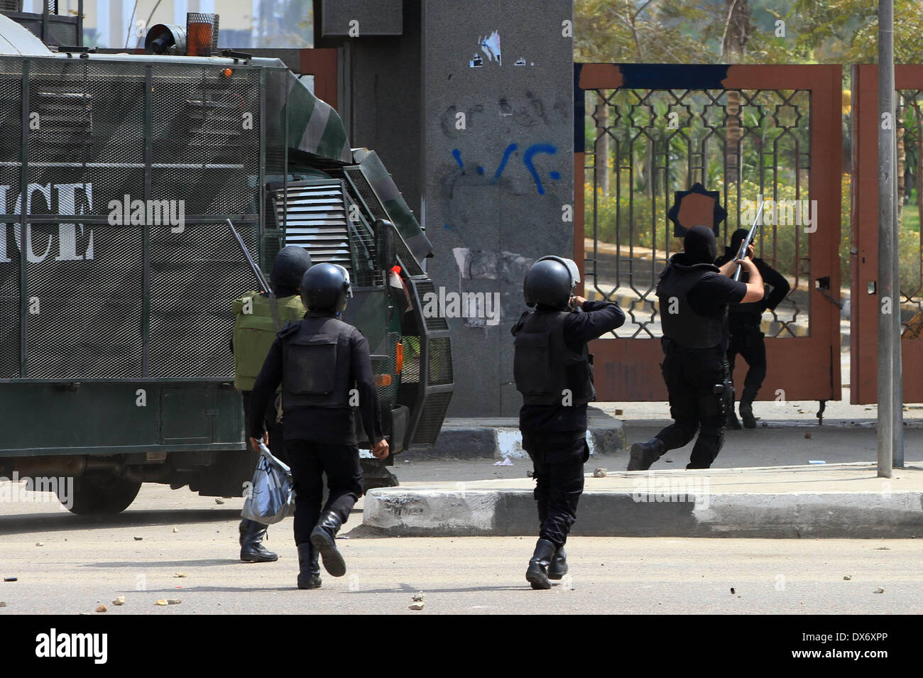 Cairo, Egypt. 19th Mar, 2014. Egyptian riot police take position during ...
