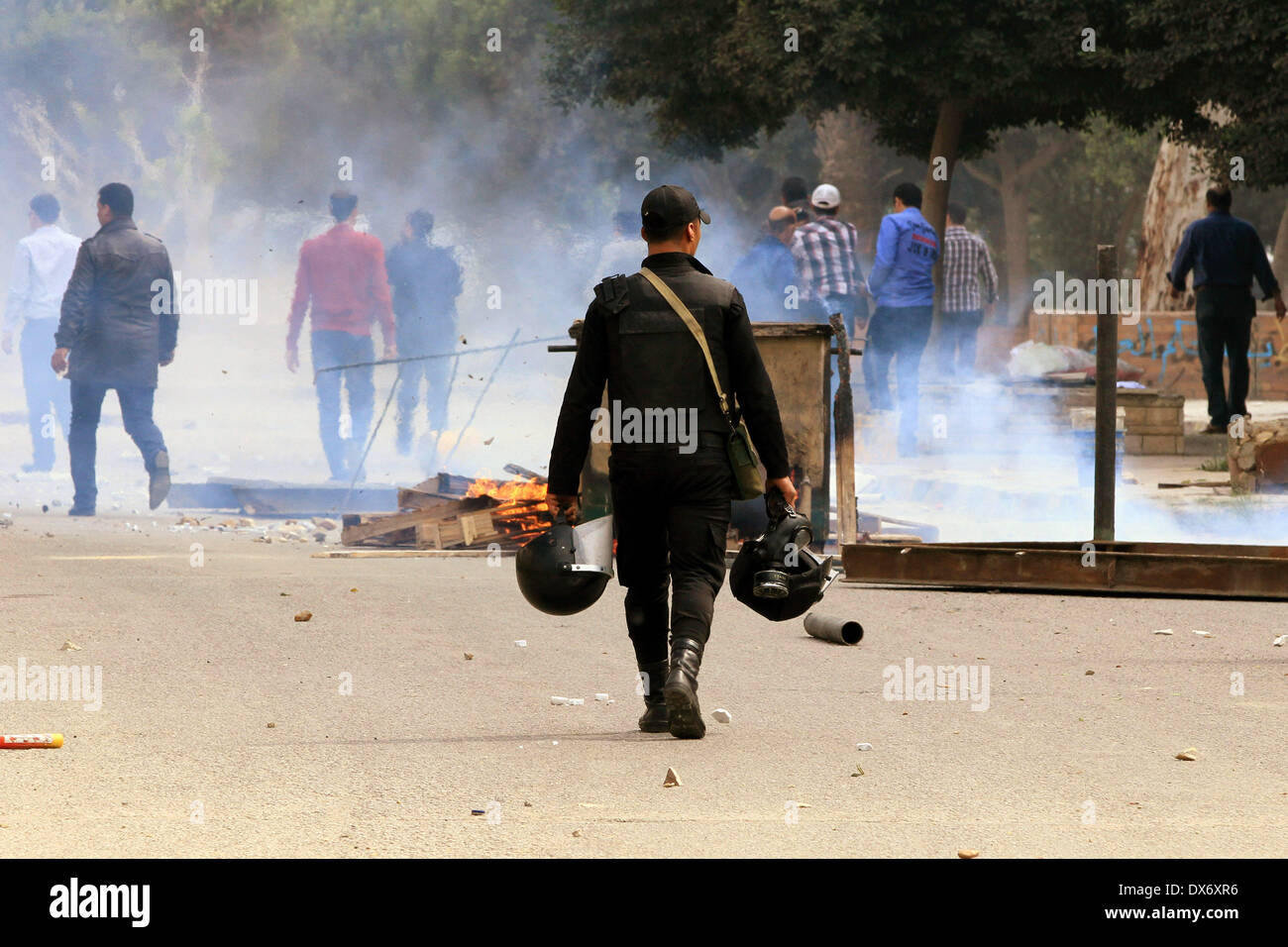Cairo, Egypt. 19th Mar, 2014. Egyptian riot police take position during ...