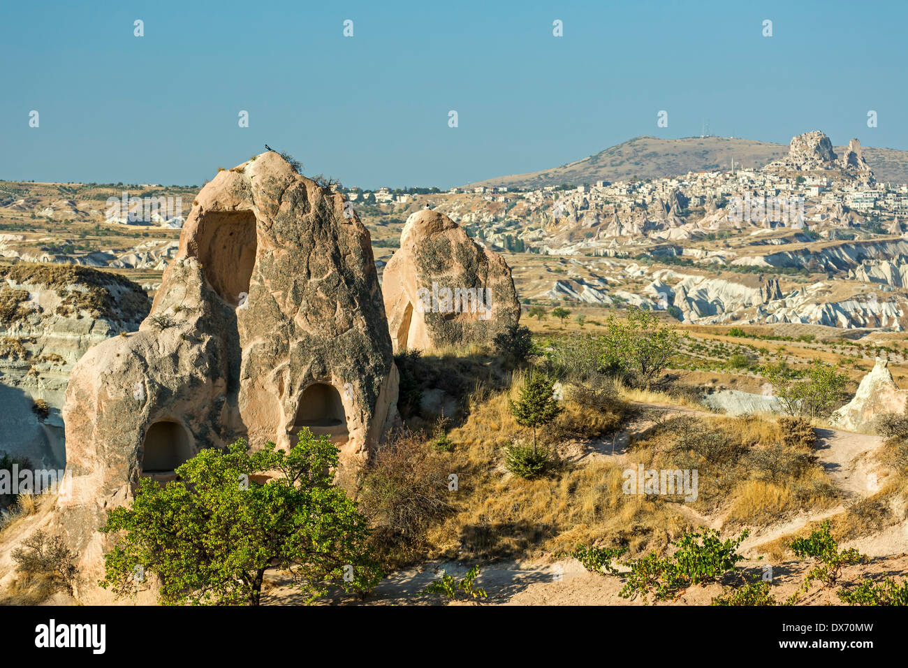 Dwellings in fairy chimneys and Uchisar (R) in distance, Red Valley ...